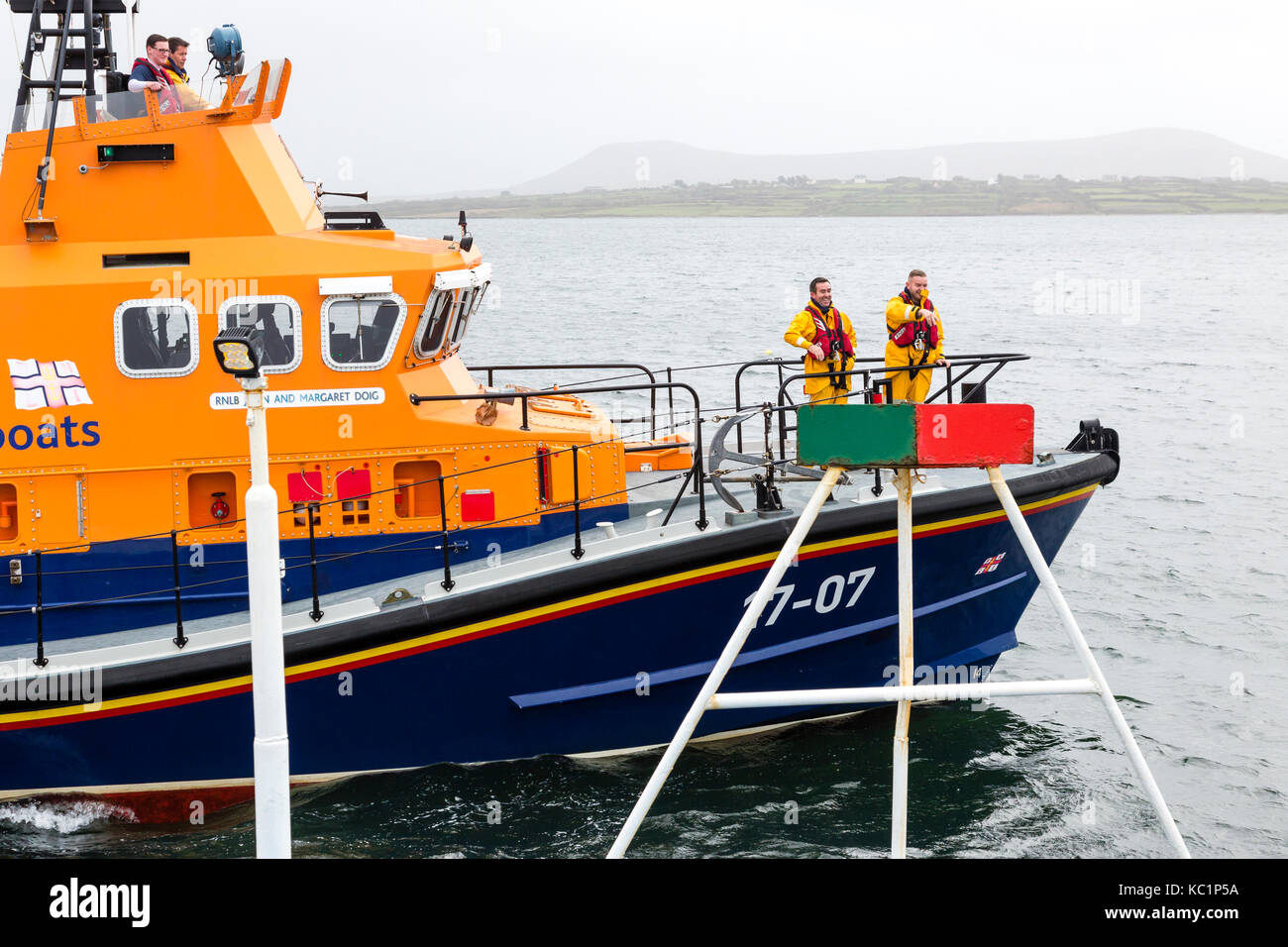 RNLI lifeboat, coming alongside the car ferry Valentia Island, County ...