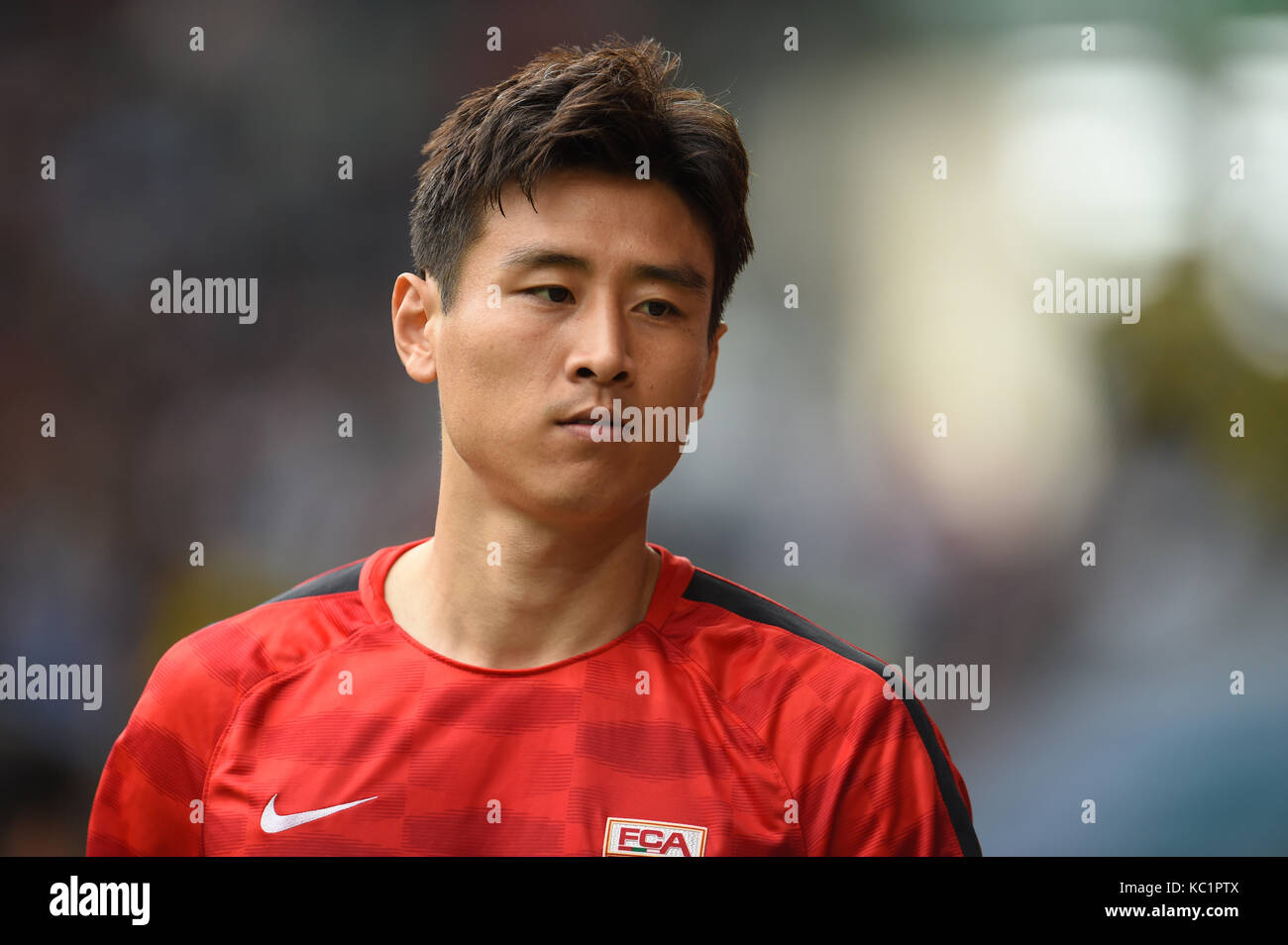 Augsburg, Germany. 30th Sep, 2017. Ja-Cheol Koo of Augsburg heads to ...