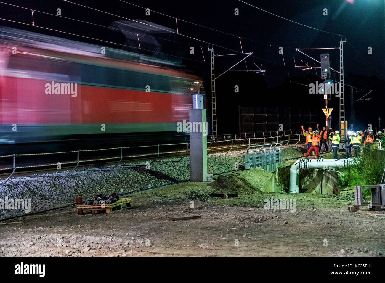 A train can be seen rushing by on the Rheintal railway route between ...