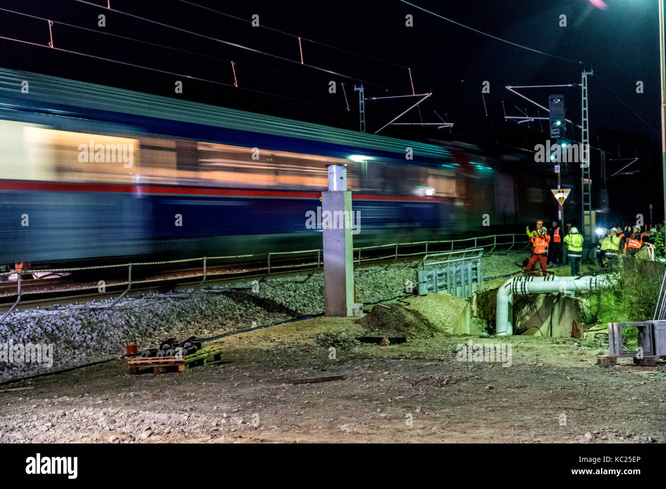 A train can be seen rushing by on the Rheintal railway route between ...