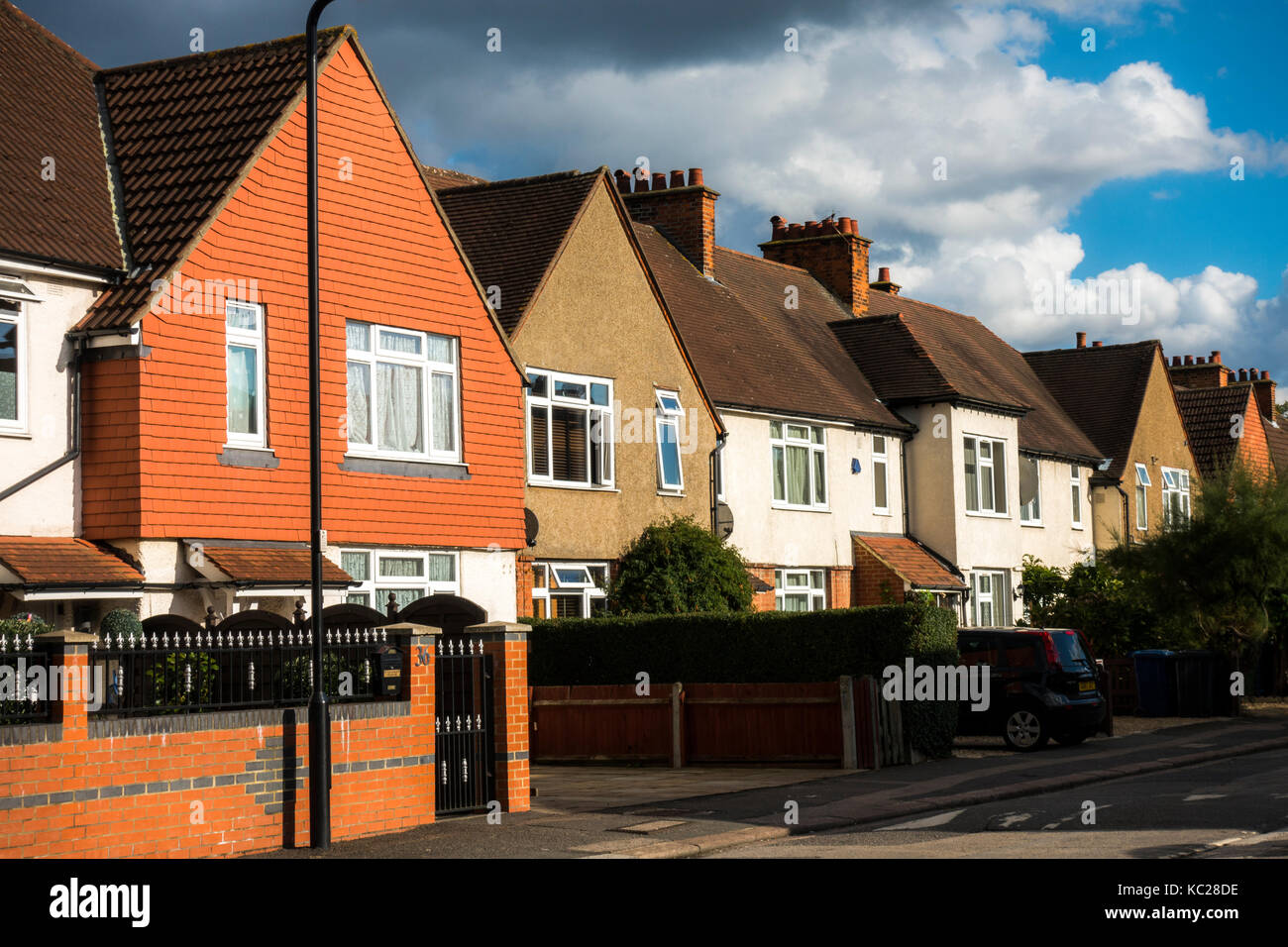 A sunlit row of traditional-build, terraced houses, located on an ex ...