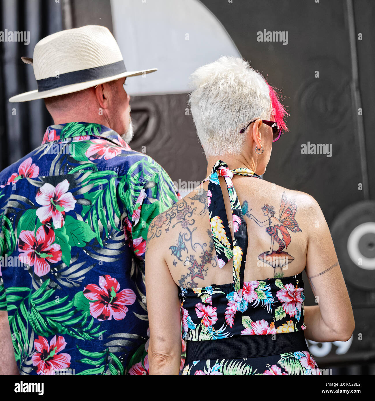 Woman with pixie crop haircut and tattoos of stars, fairy & butterflies ...