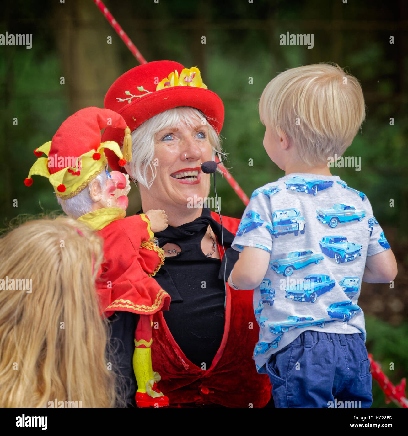 Professor Queen-Bee with Mr Punch and fascinated young boy Stock Photo ...