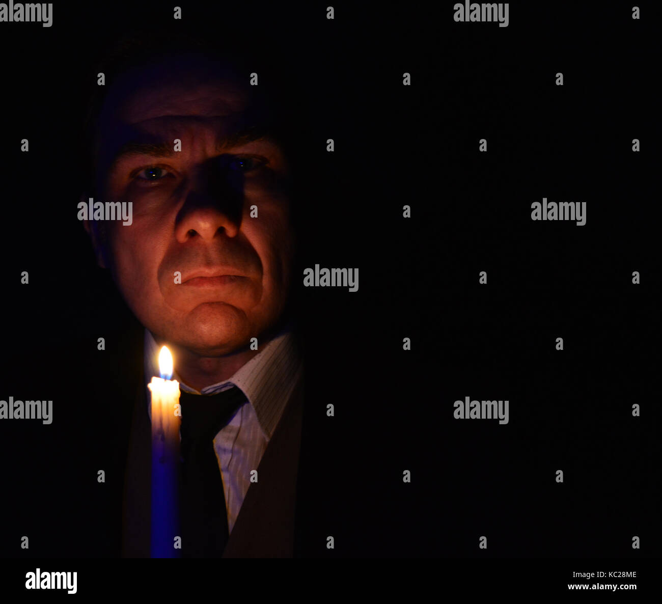 Butler with candle Stock Photo - Alamy
