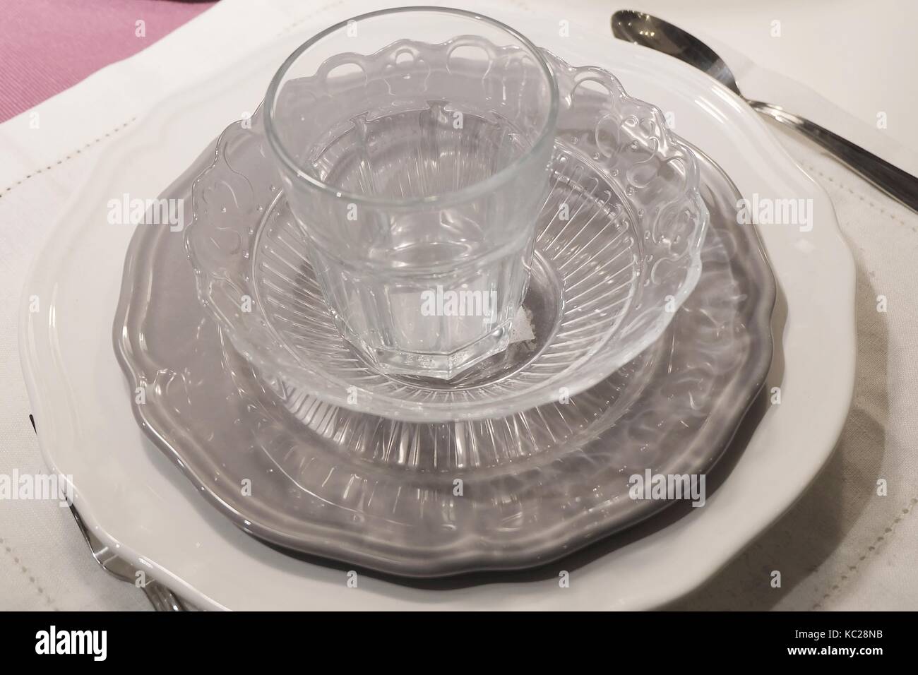 Kitchen Utensil, Set of White Porcelain Plates and Glass with Spoon ...