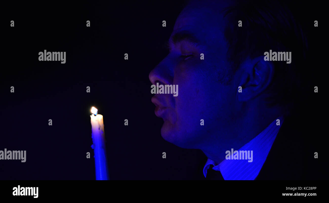 Butler with candle Stock Photo - Alamy