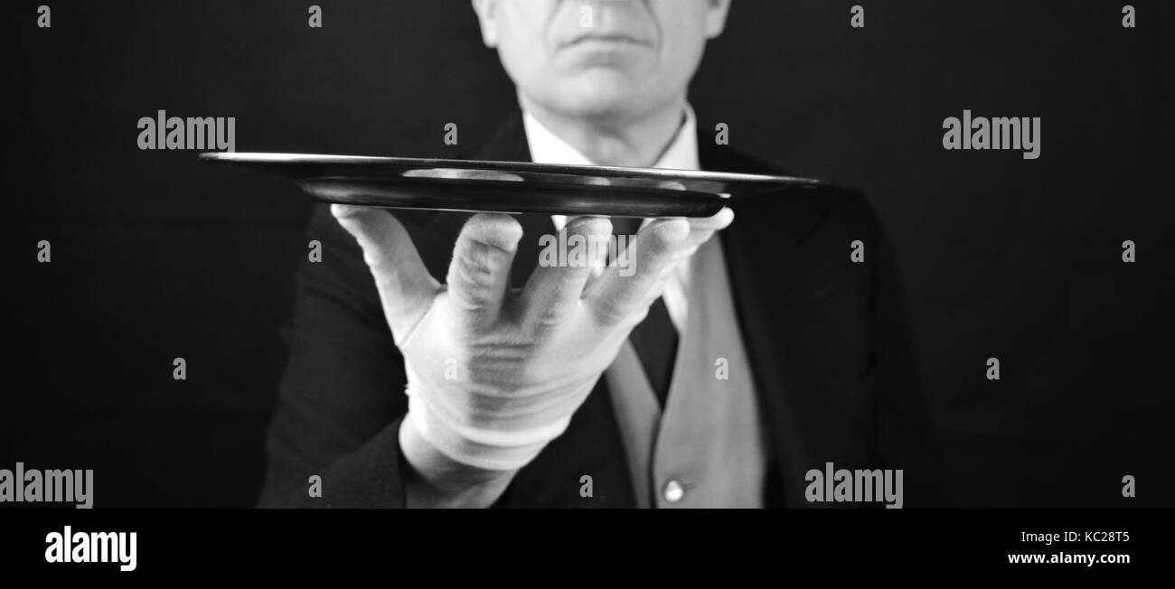 Butler with tray Stock Photo - Alamy