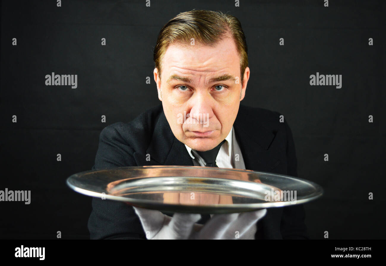 Butler with tray Stock Photo - Alamy