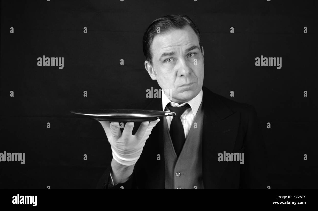 Butler with tray Stock Photo - Alamy