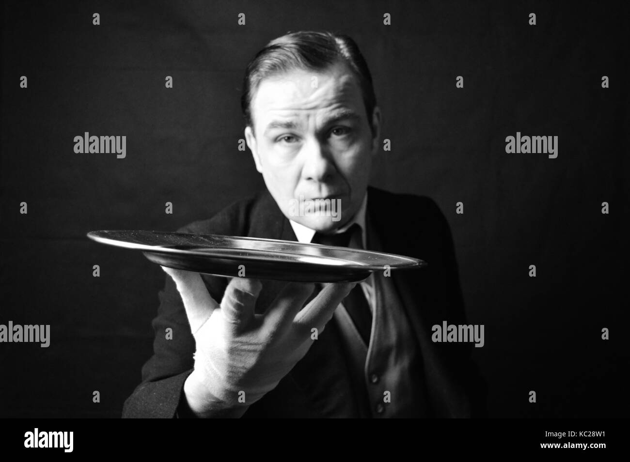 Butler with tray Stock Photo - Alamy