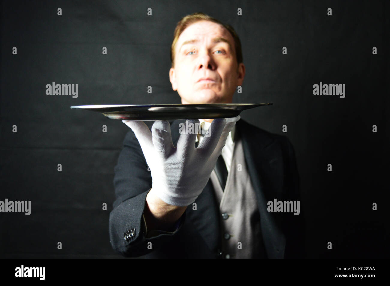 Butler with tray Stock Photo - Alamy