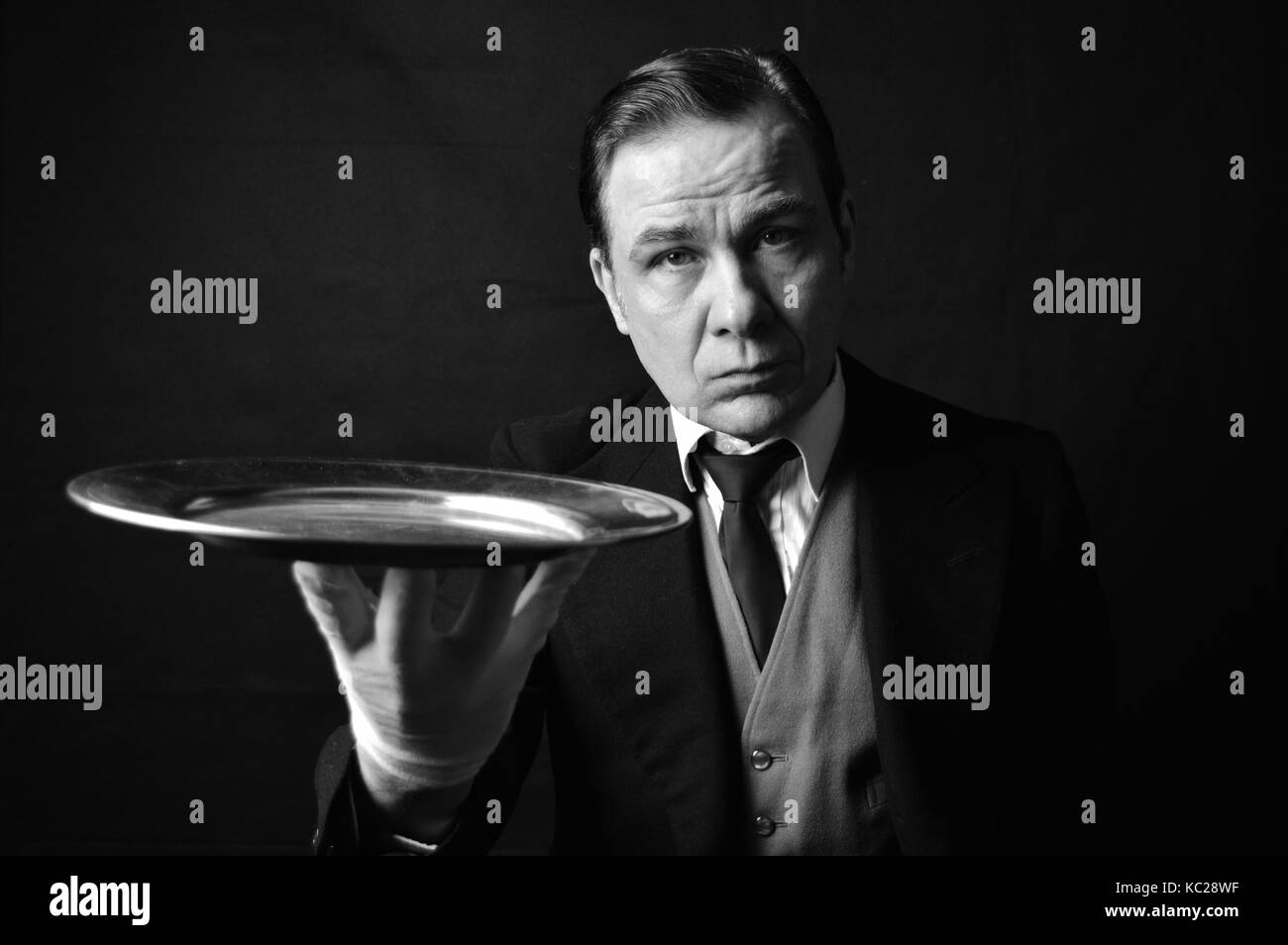 Butler with tray Stock Photo - Alamy