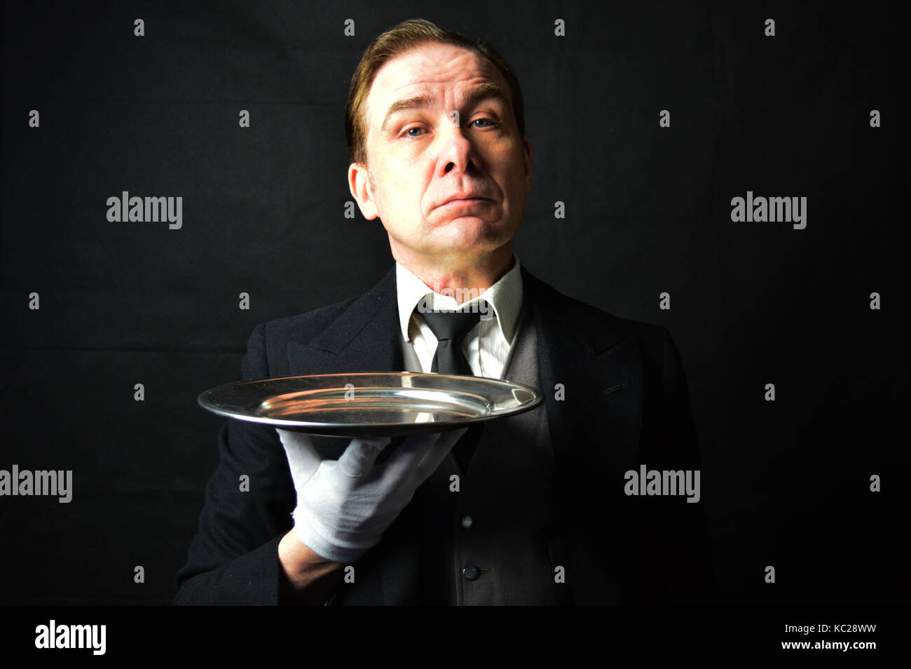 Butler with tray Stock Photo - Alamy