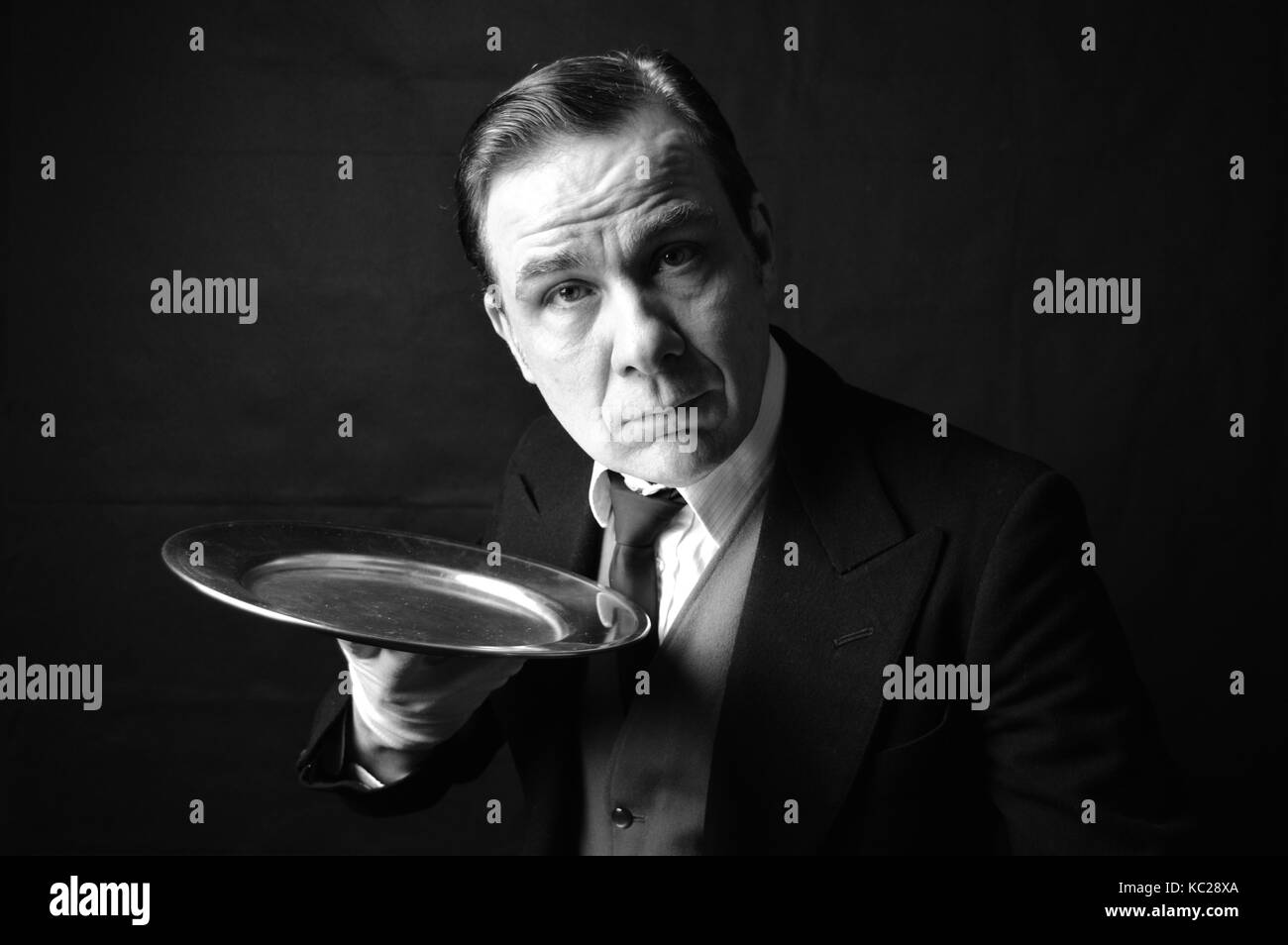 Butler with tray Stock Photo - Alamy