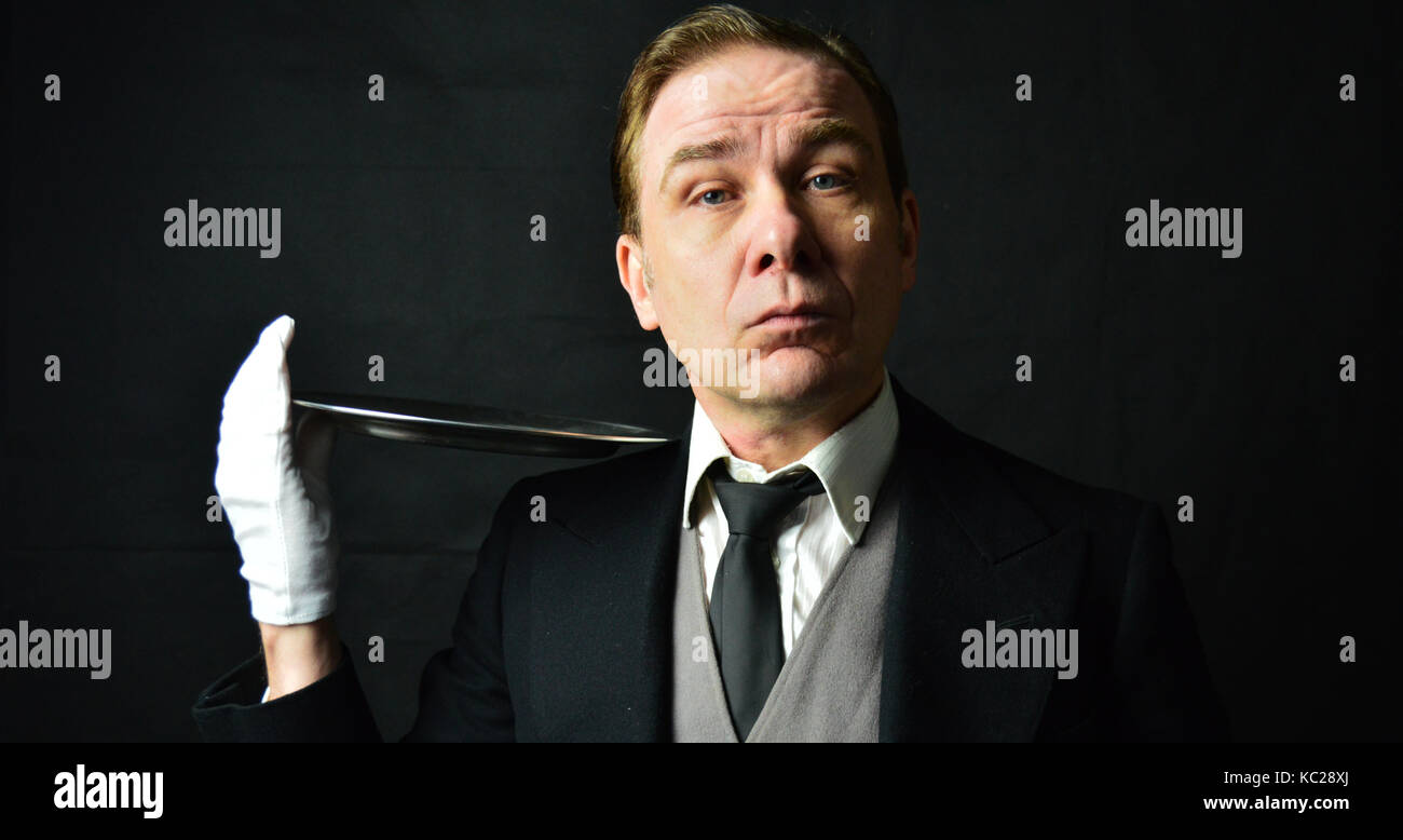 Butler with tray Stock Photo - Alamy