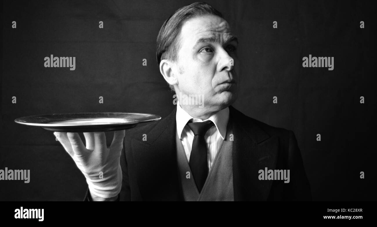 Butler with tray Stock Photo - Alamy