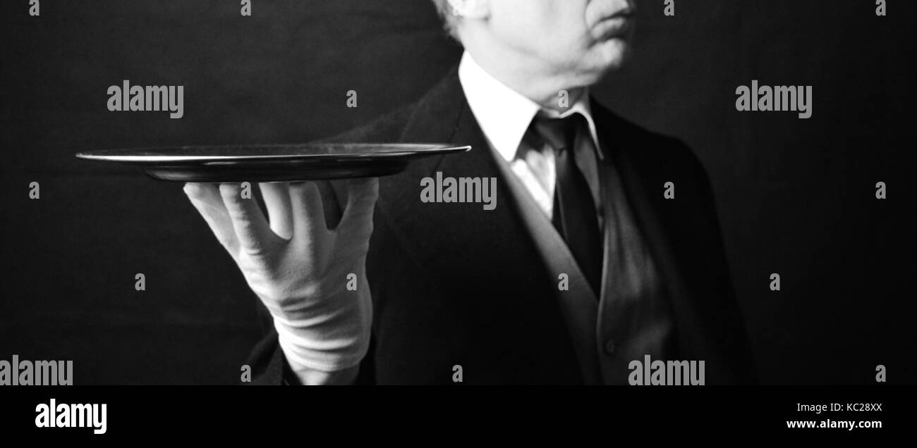 Butler with tray Stock Photo - Alamy