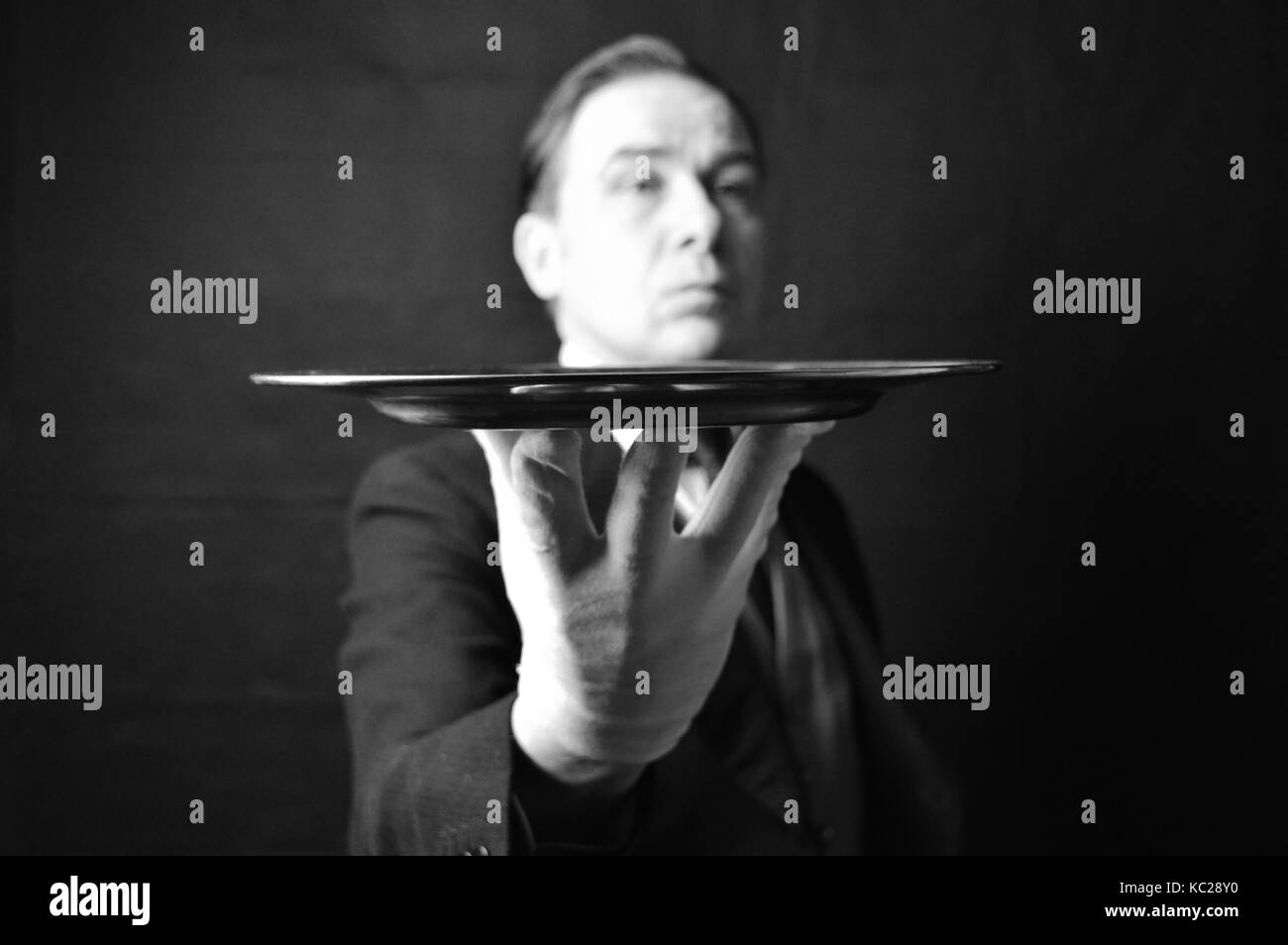 Butler with tray Stock Photo - Alamy