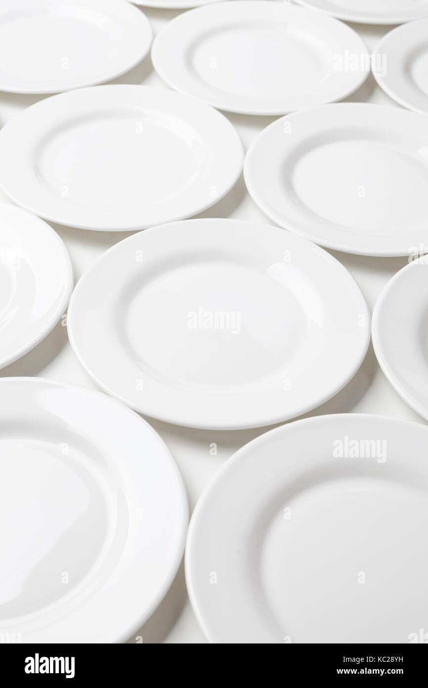 White plates isolated on white background Stock Photo - Alamy