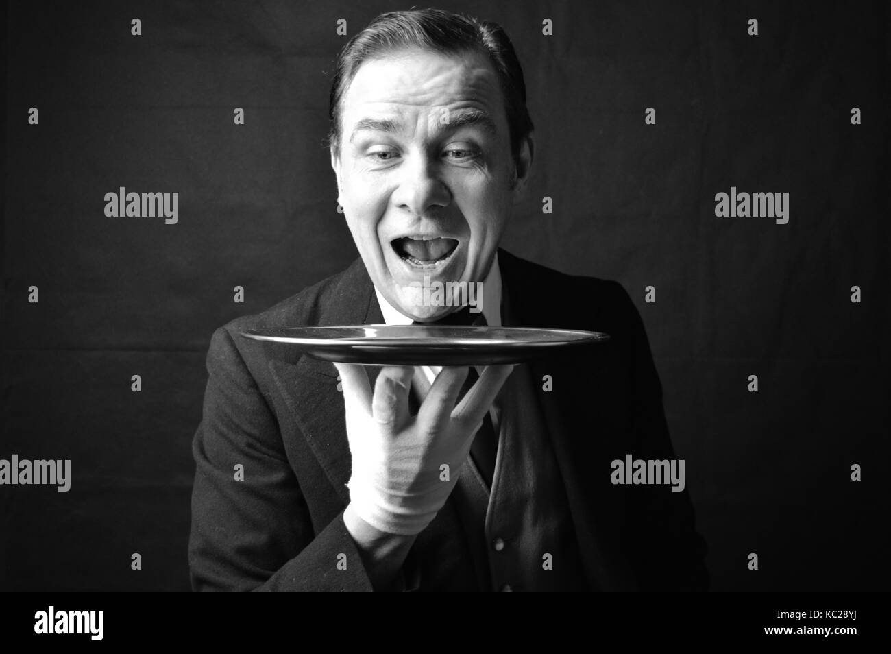 Butler with tray Stock Photo - Alamy