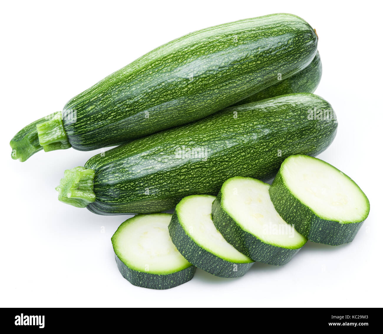 Zucchini with slices on a white background Stock Photo - Alamy