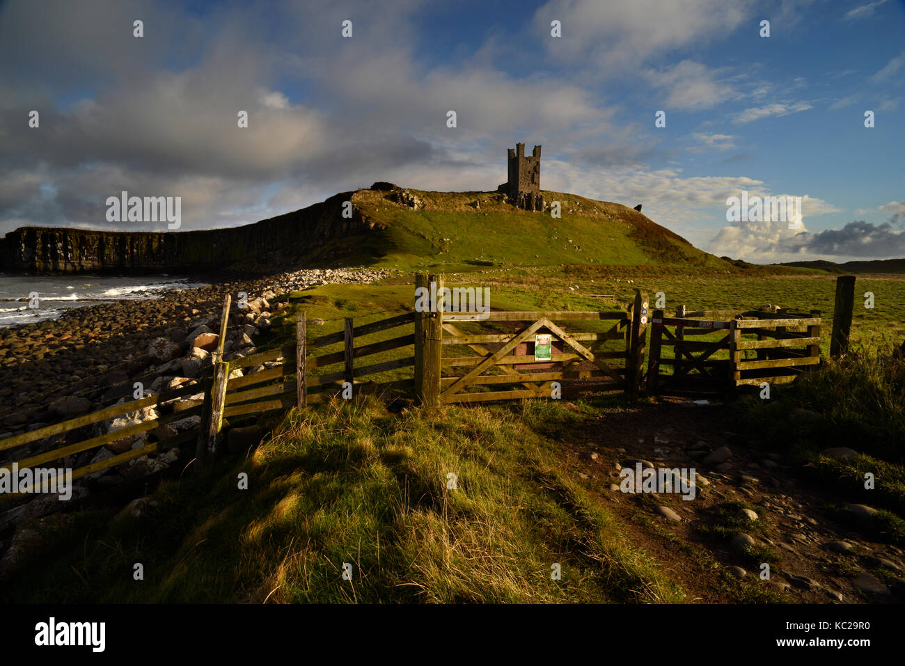 Early light on Dunstanburgh Castle Stock Photo - Alamy