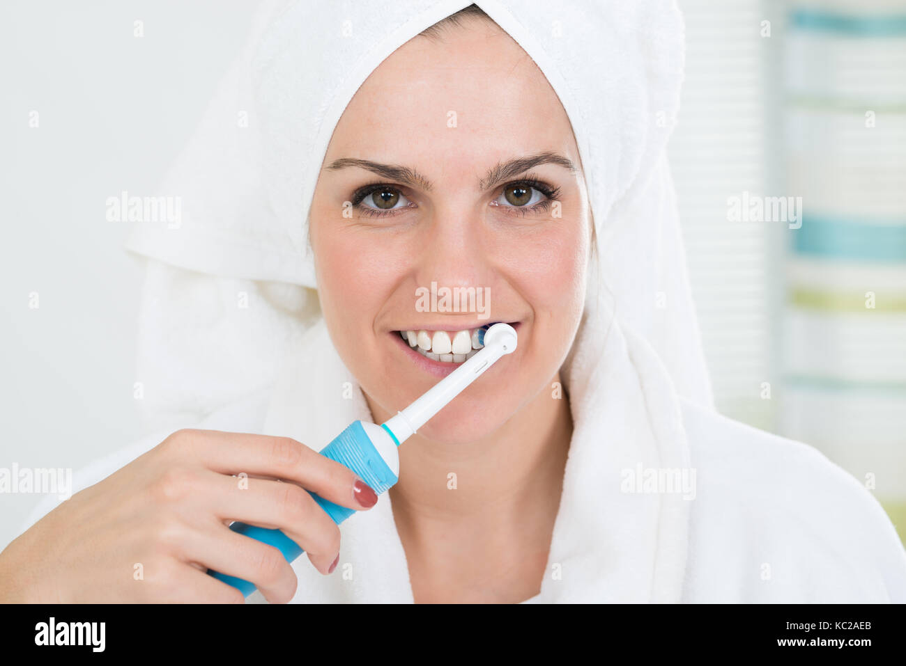 Close-up Of A Young Woman Brushing Teeth With Electric Toothbrush Stock ...