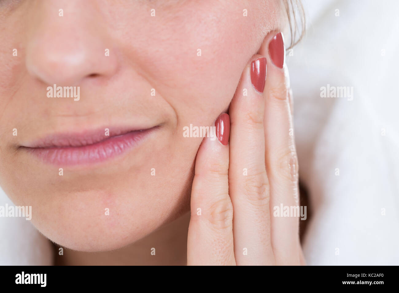 Close-up Of A Woman With Toothache Touching Face Stock Photo - Alamy