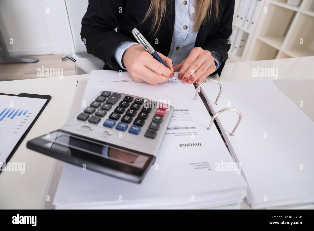 Close-up Of A Businesswoman Calculating Invoice With Calculator Stock ...