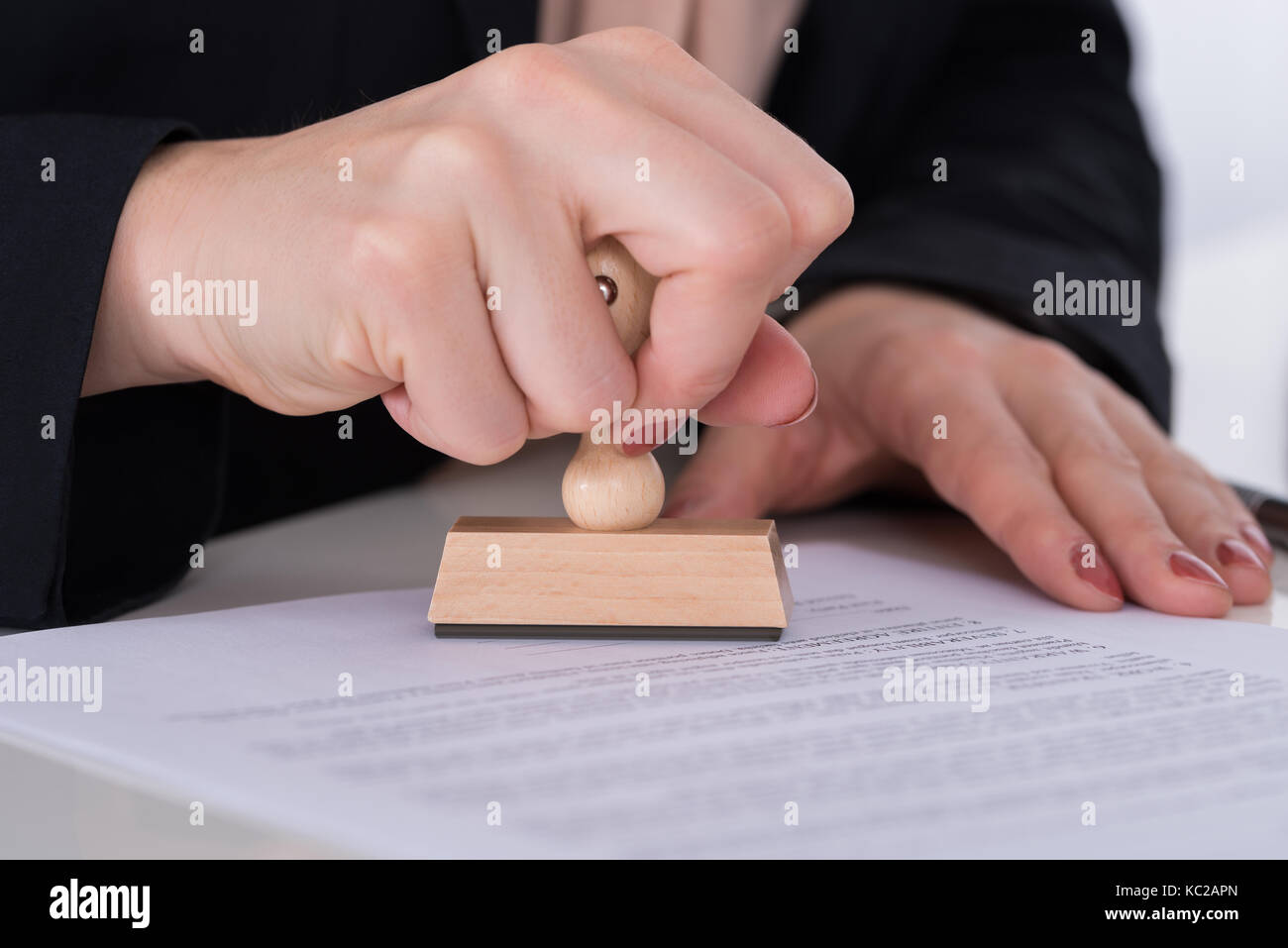 Close-up Of Businessperson Hand Using Stamper On Document Stock Photo ...