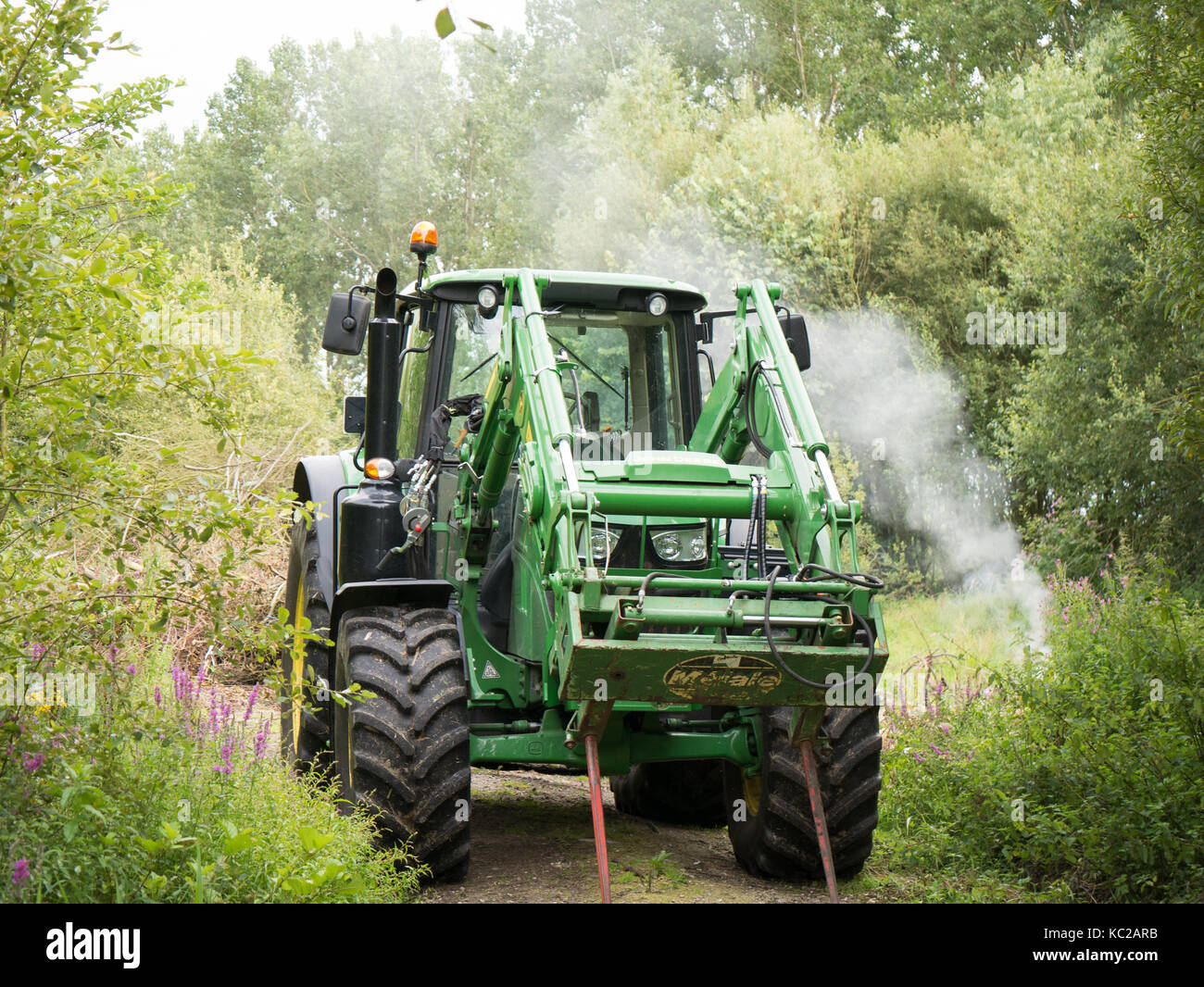 Tractor in field Stock Photo - Alamy