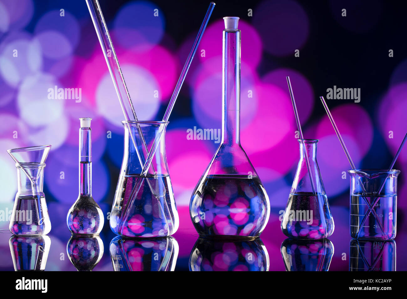 Laboratory concept. Beakers and test-tubes. Coloful bokeh background ...