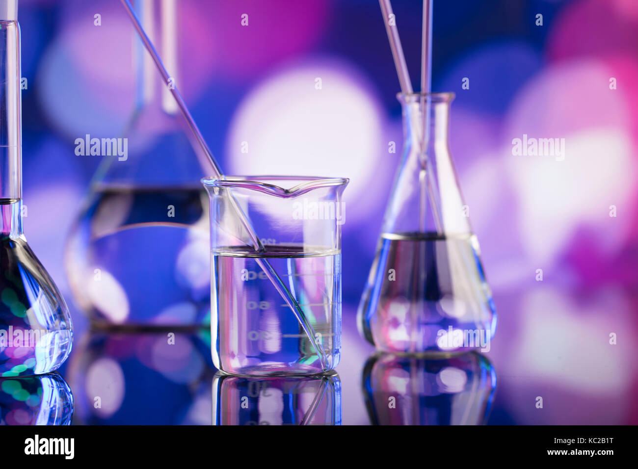 Laboratory concept. Beakers and test-tubes. Coloful bokeh background ...