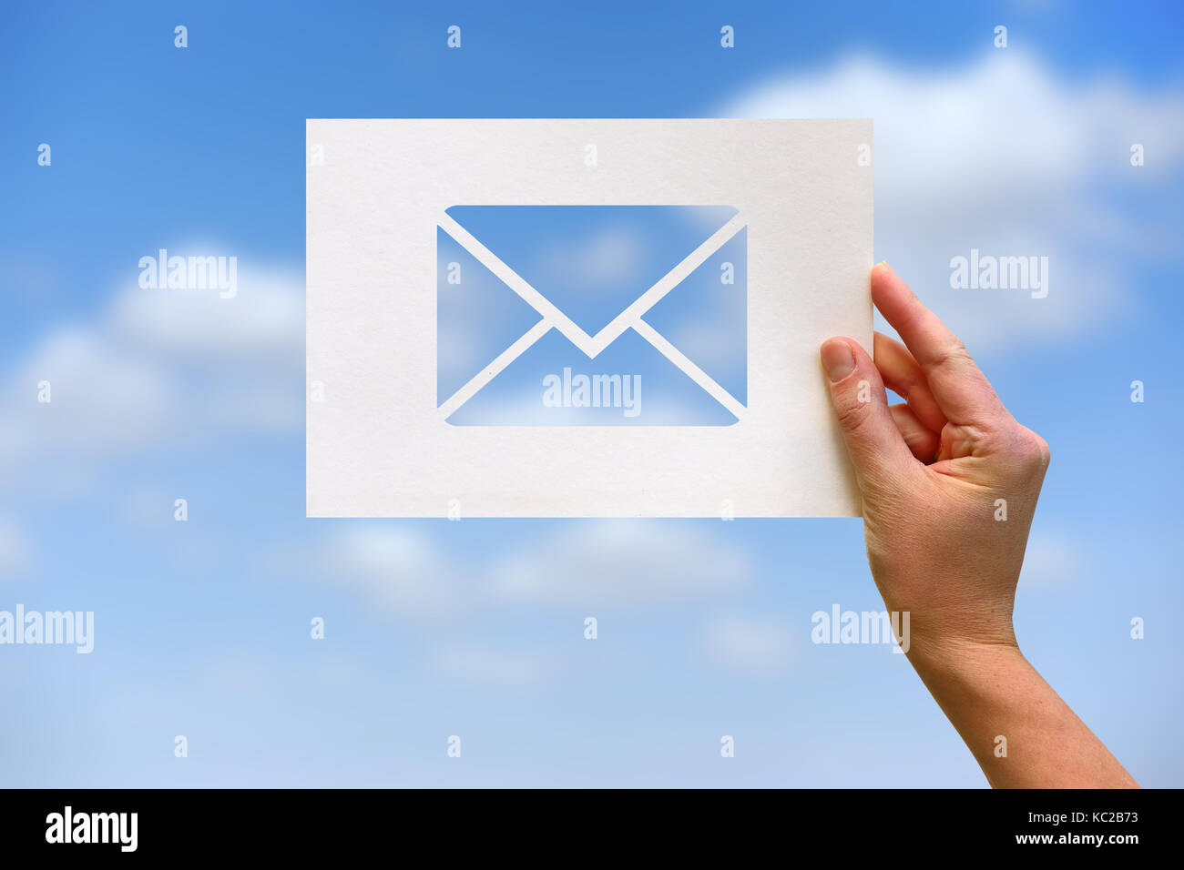 Female hand holding paper blank with email network communication ...