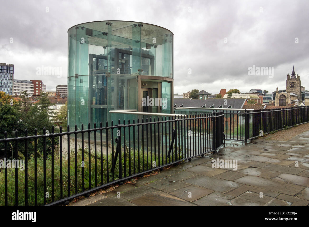 Modern glass lift and cityscape at the side of the Norwich Castle ...