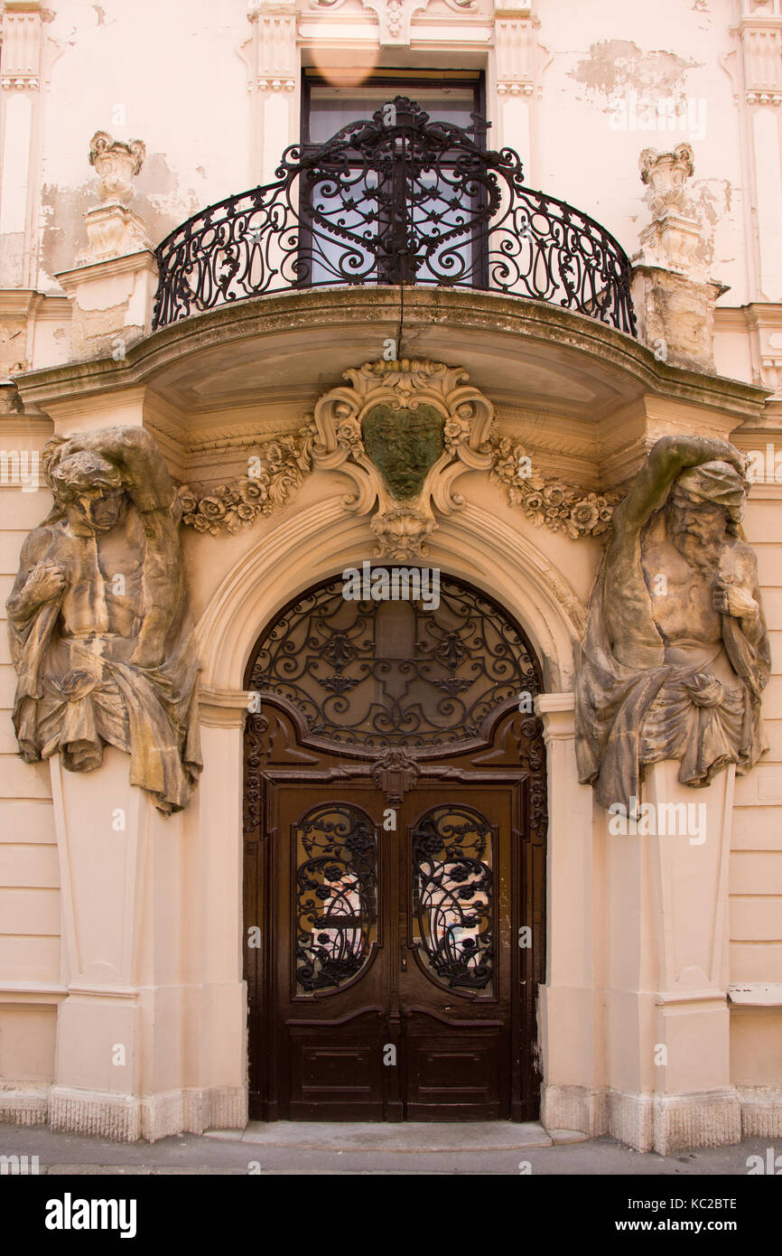 Beautiful baroque style entrance with an iron balcony and arch Stock ...