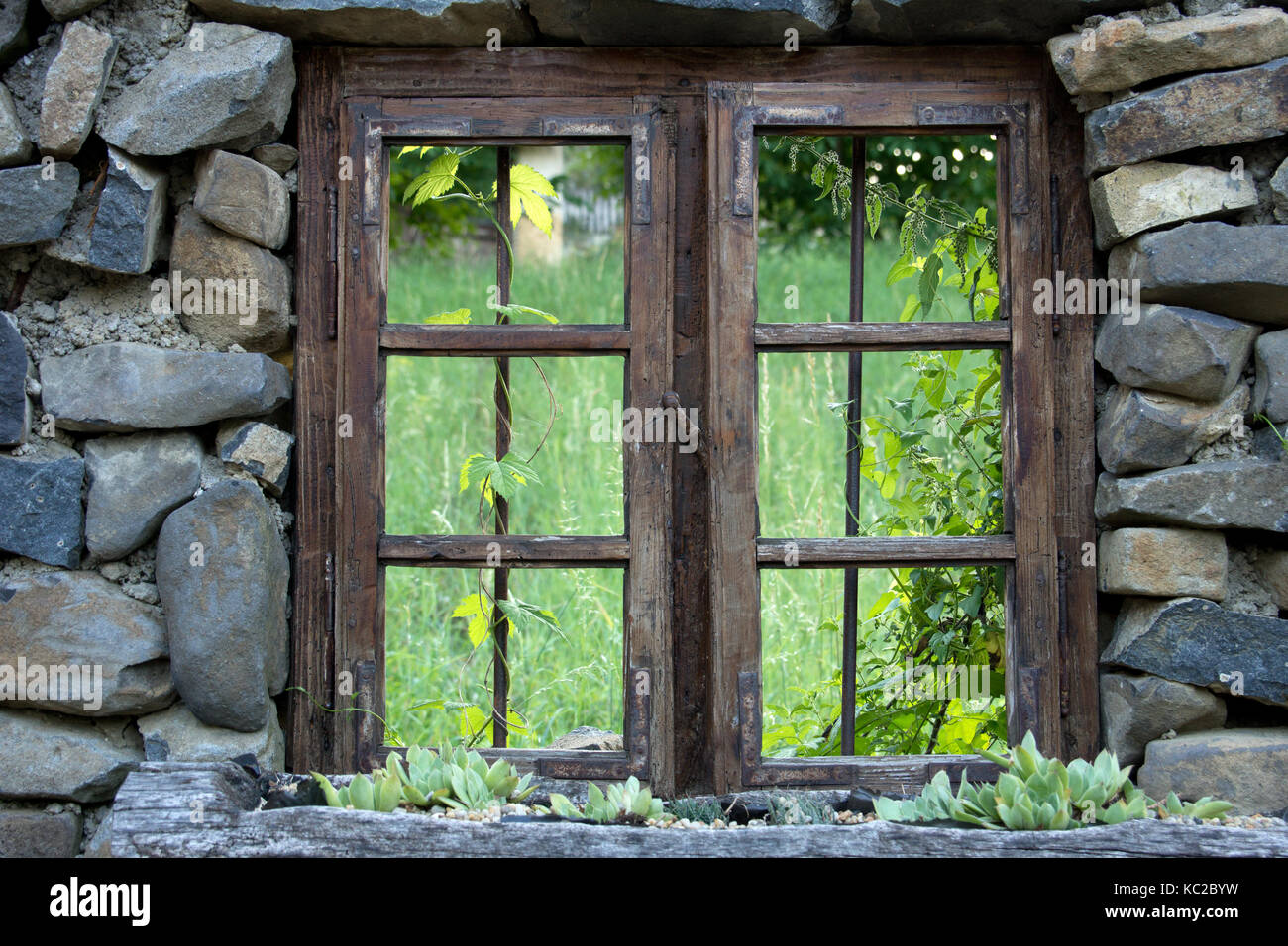View through a window in an old brick wall Stock Photo - Alamy