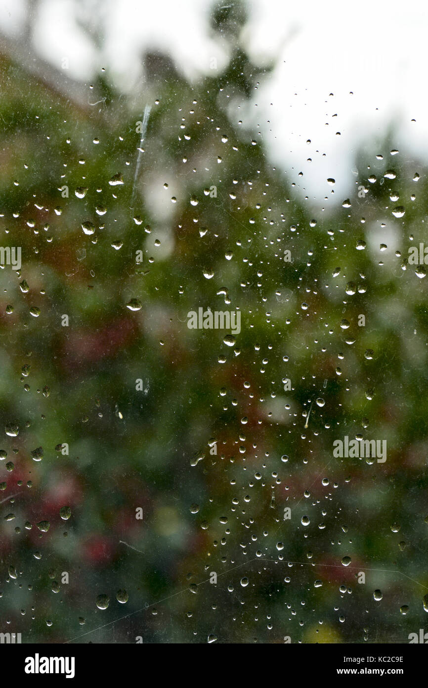 Looking out through rain drops on a dirty window pane Stock Photo - Alamy