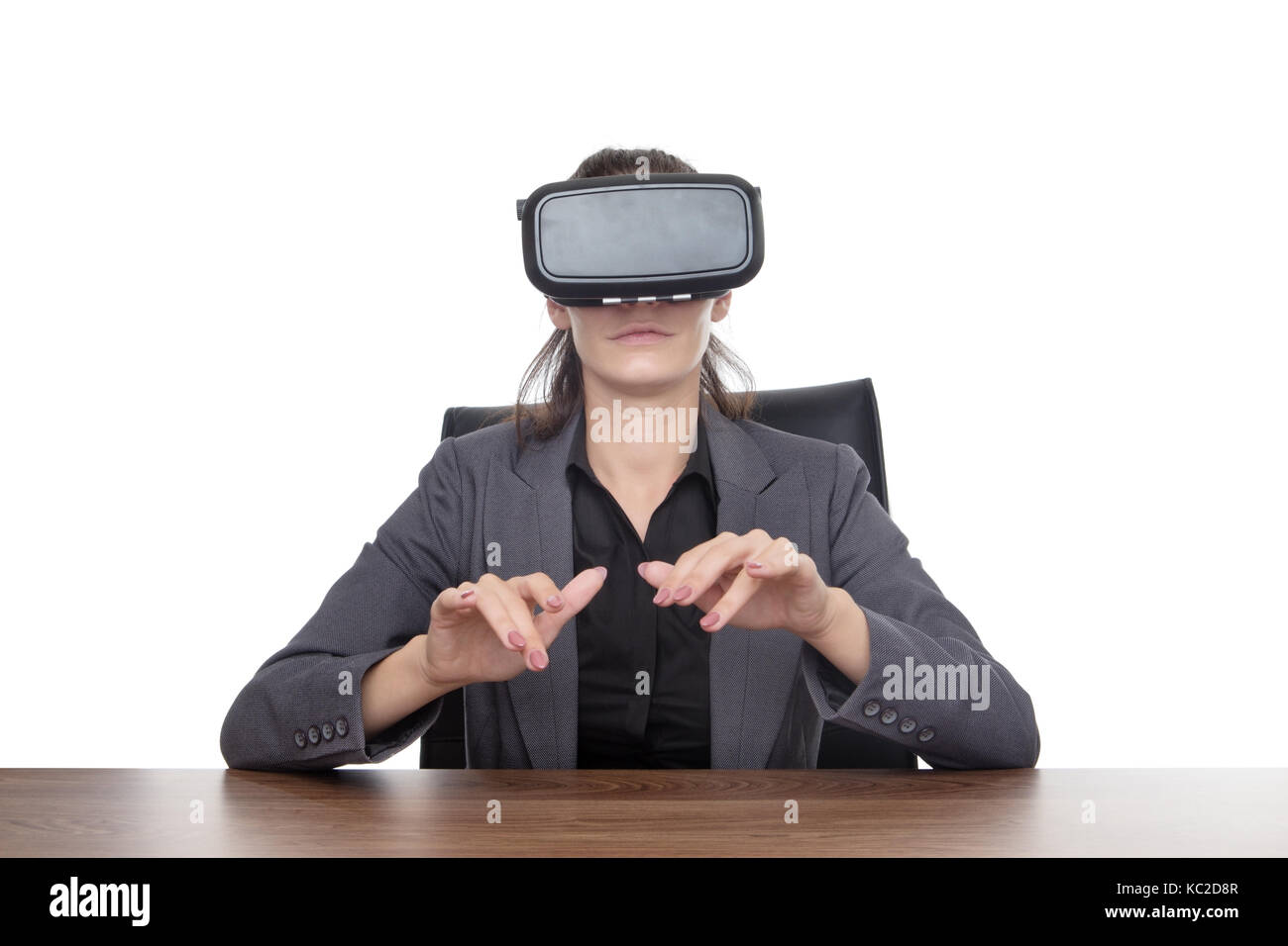 business woman sitting at desk working using a vr headset Stock Photo ...