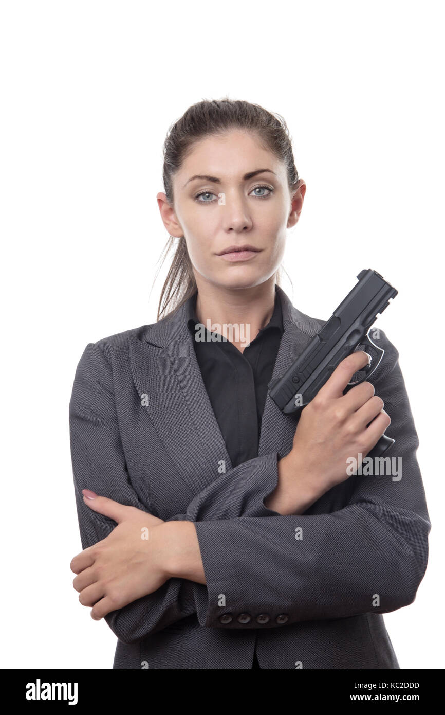 business woman holding a gun looking at camera Stock Photo - Alamy