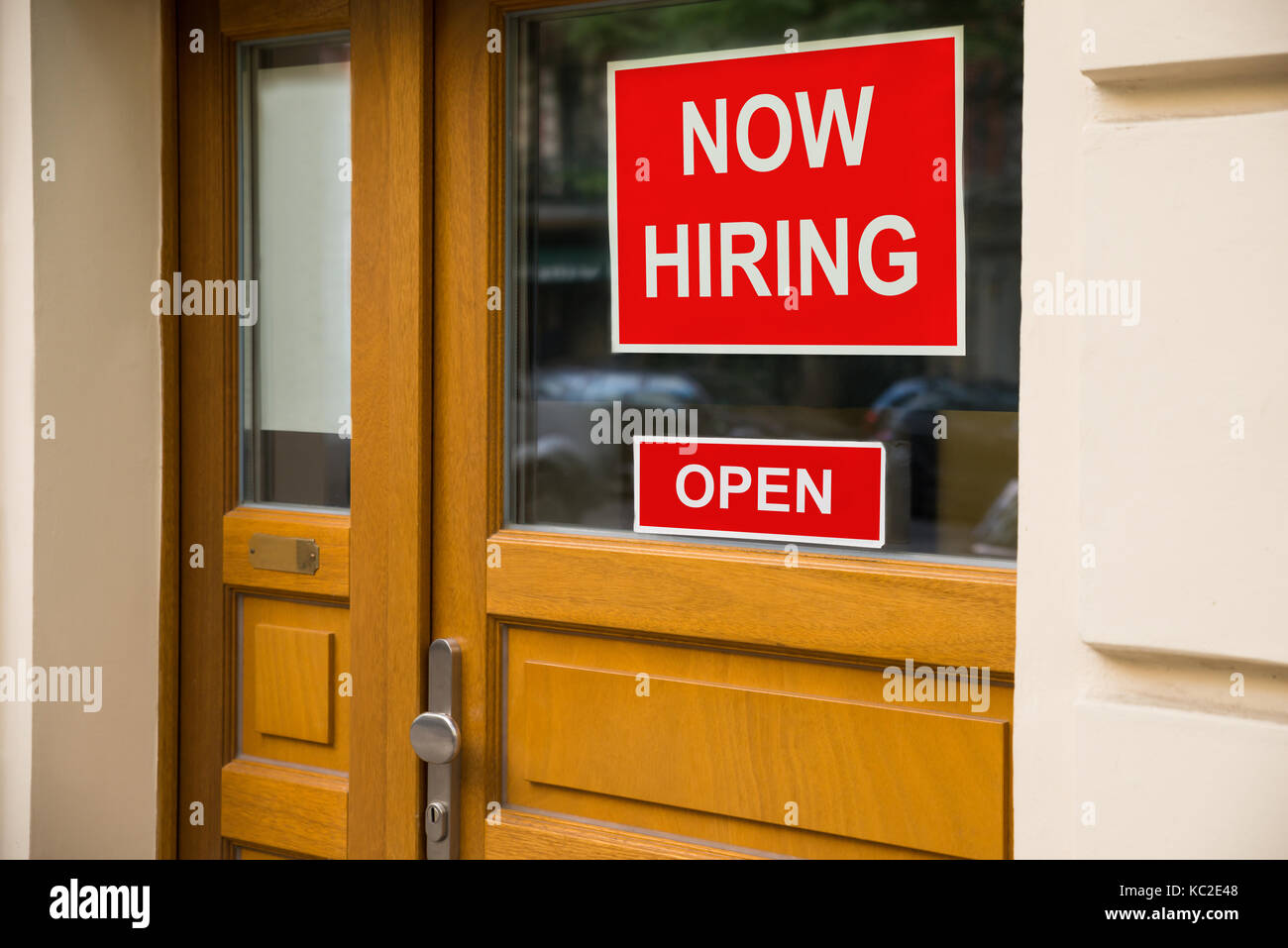 The Text Now Hiring Sticker Attached On Glass Door Of The Office Stock ...