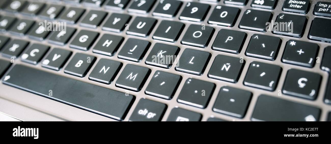 Forefront of a gray laptop keyboard Stock Photo - Alamy