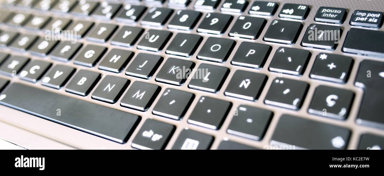 Forefront of a gray laptop keyboard Stock Photo - Alamy