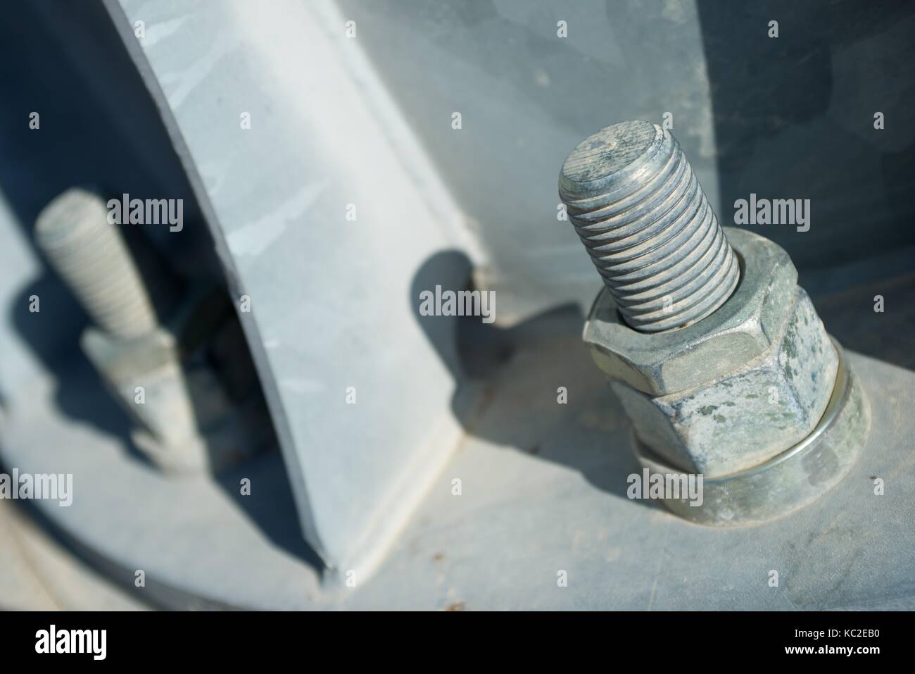 Close up of some larger screws into the base of a metal pillar Stock ...