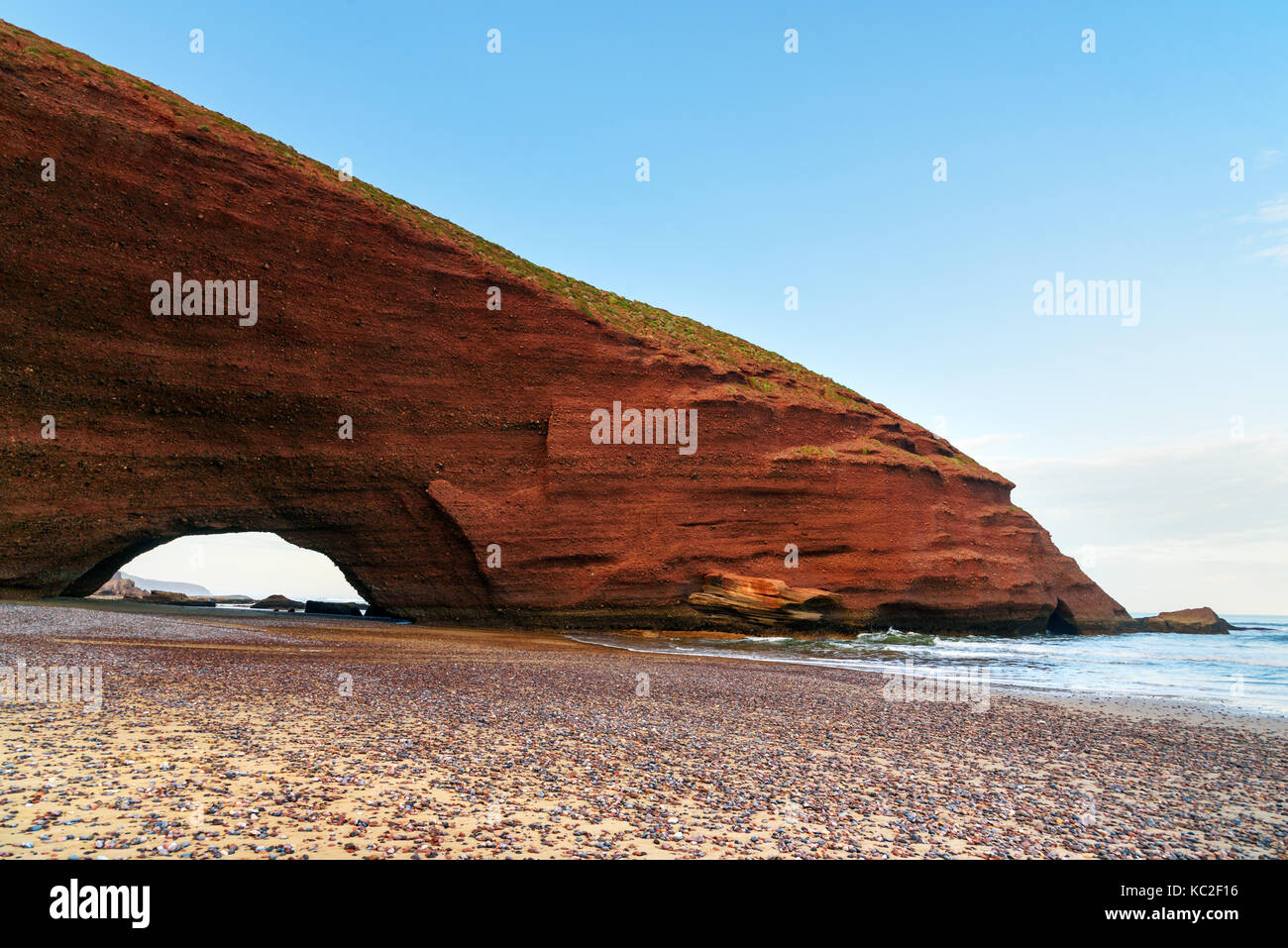 Legzira beach with huge arch of rock in the morning. Morocco Stock ...