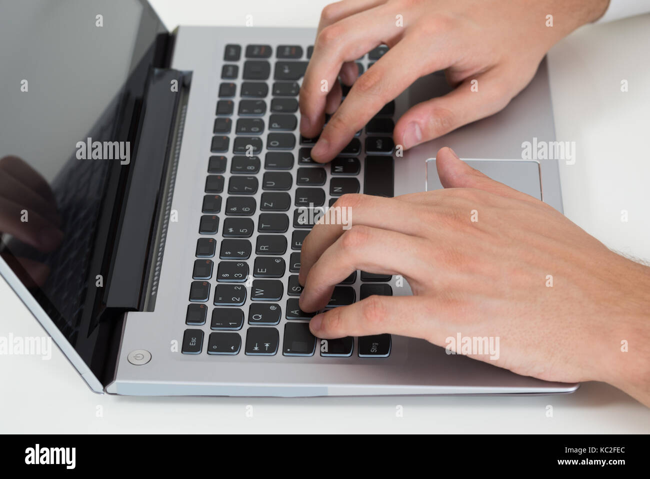 Close-up Of Person Hands Using Laptop Keypad Stock Photo - Alamy