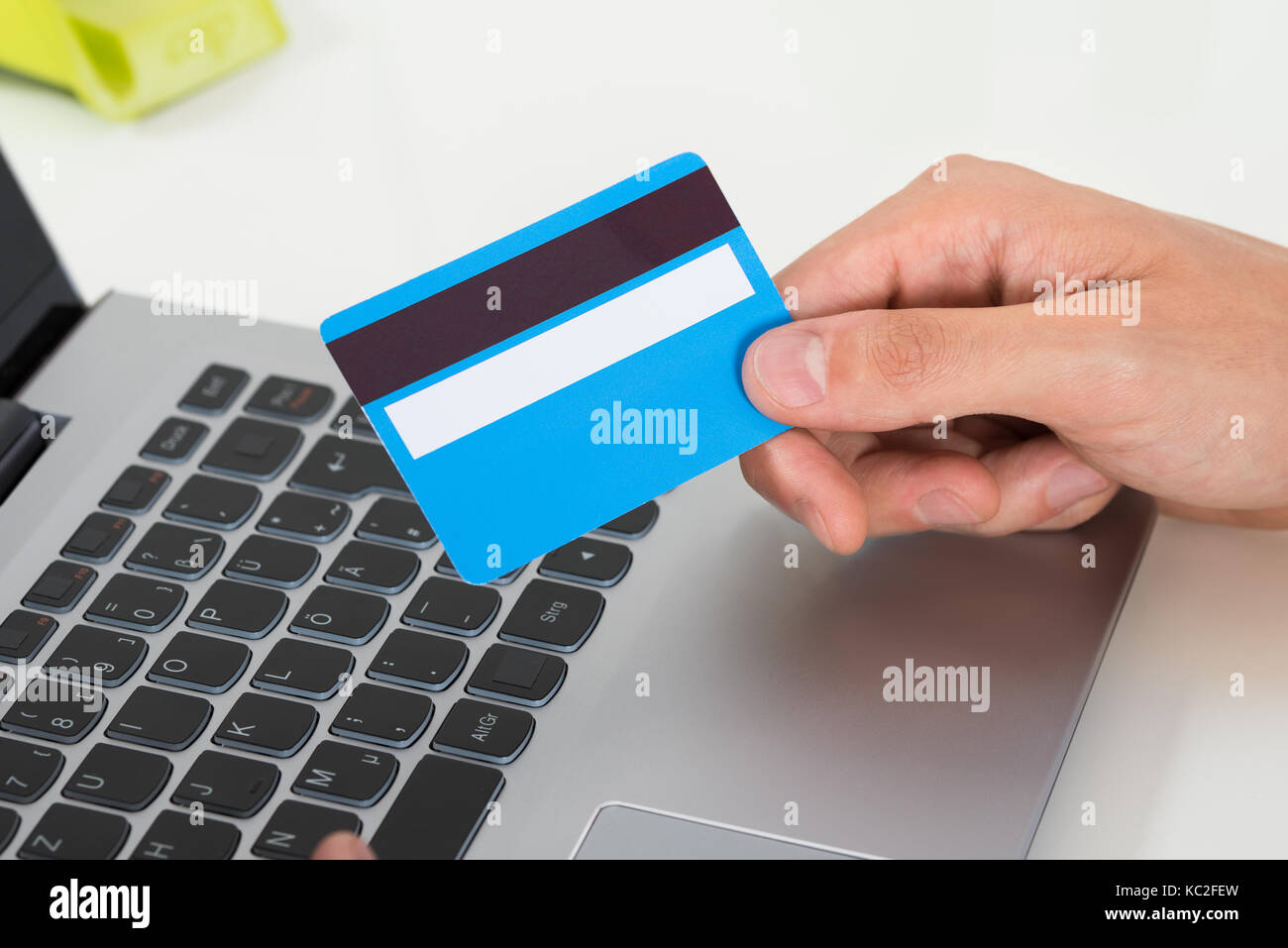 Close-up Of Person Hands Holding Credit Card Over Laptop Keypad Stock ...