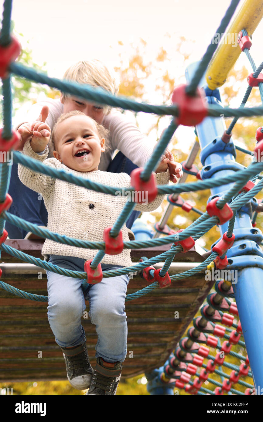 Happy child having fun at the playground Stock Photo - Alamy