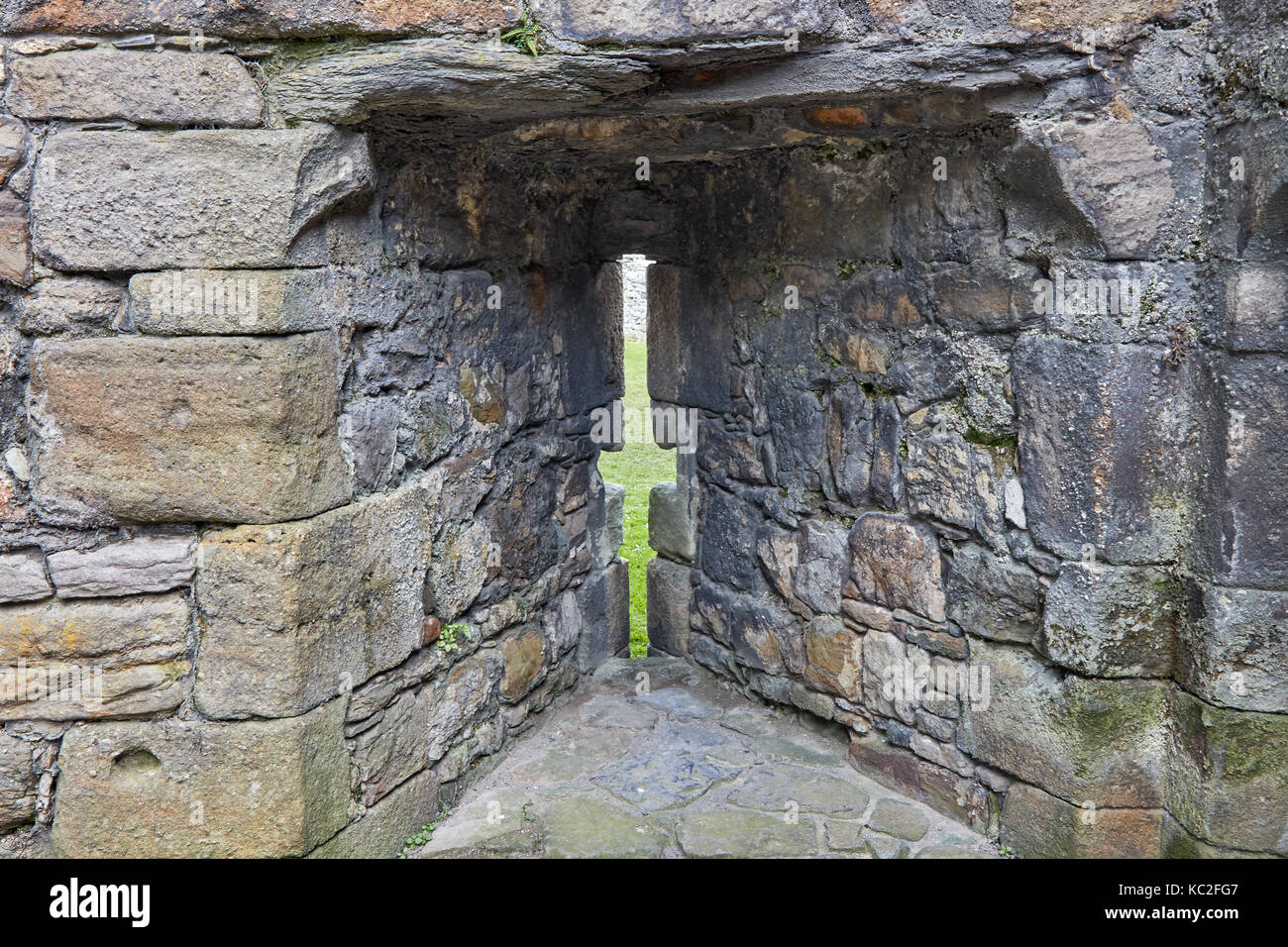 Loophole in the form of cross in castle Stock Photo - Alamy
