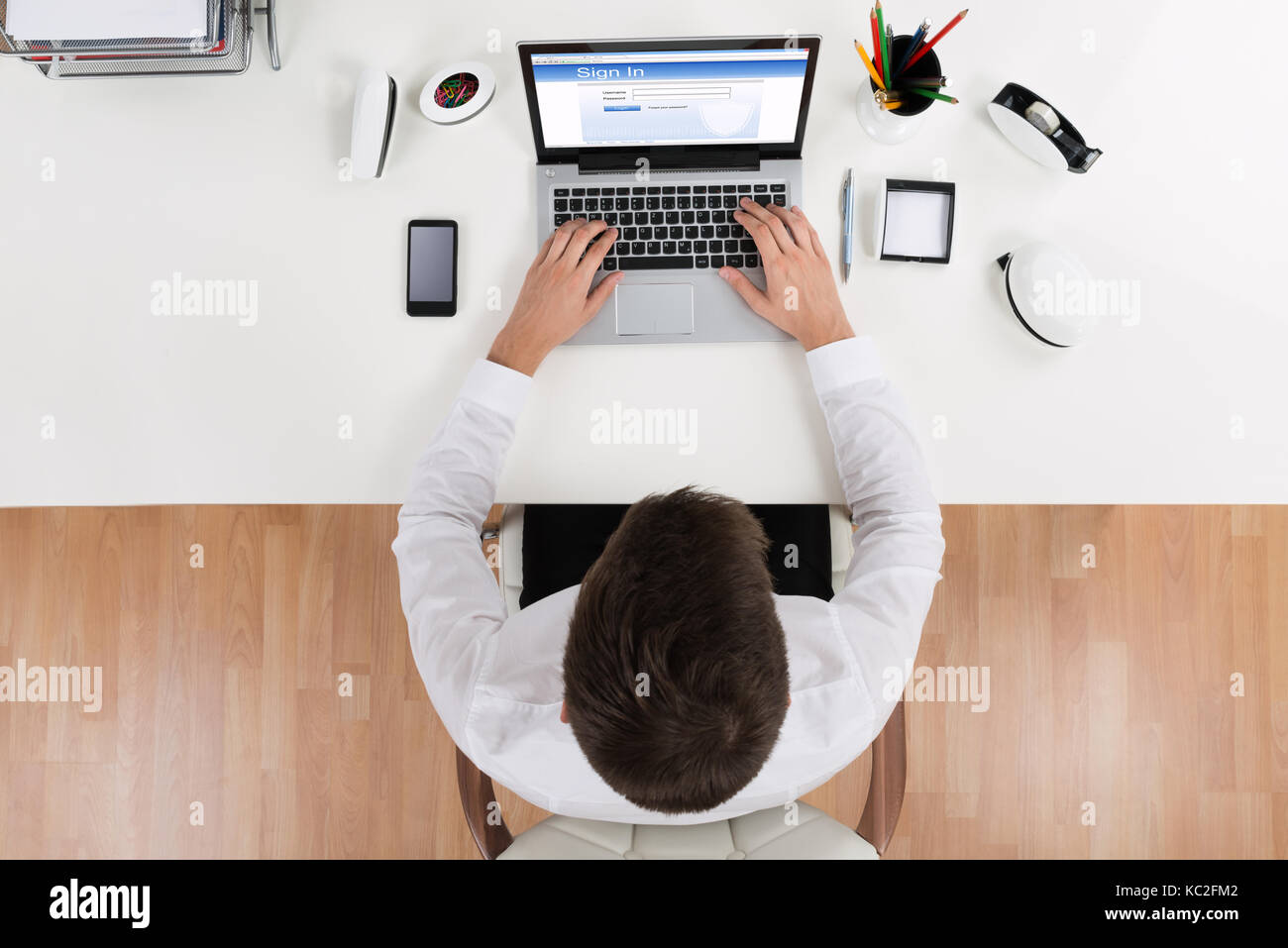 High Angle View Of Businessman Doing Login Of Online Account Using ...